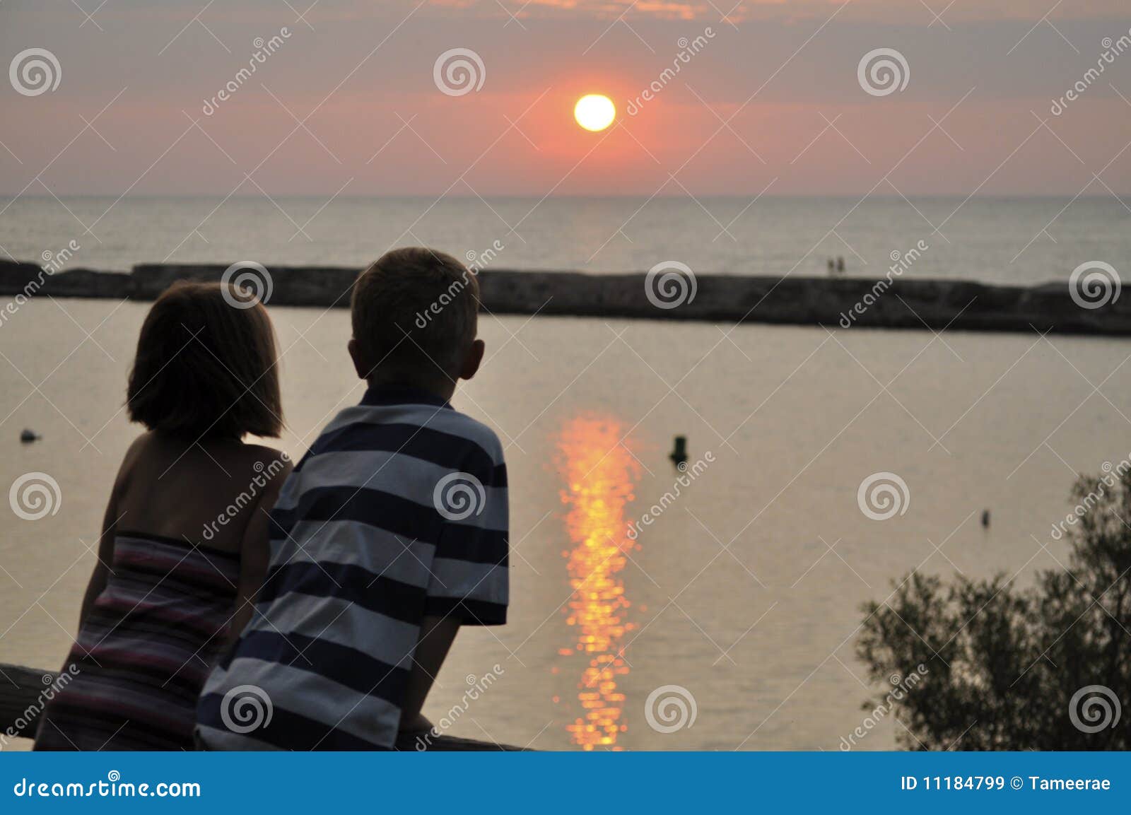 Young Boy and Girl Overlooking Sunset and Water Stock Image - Image of ...