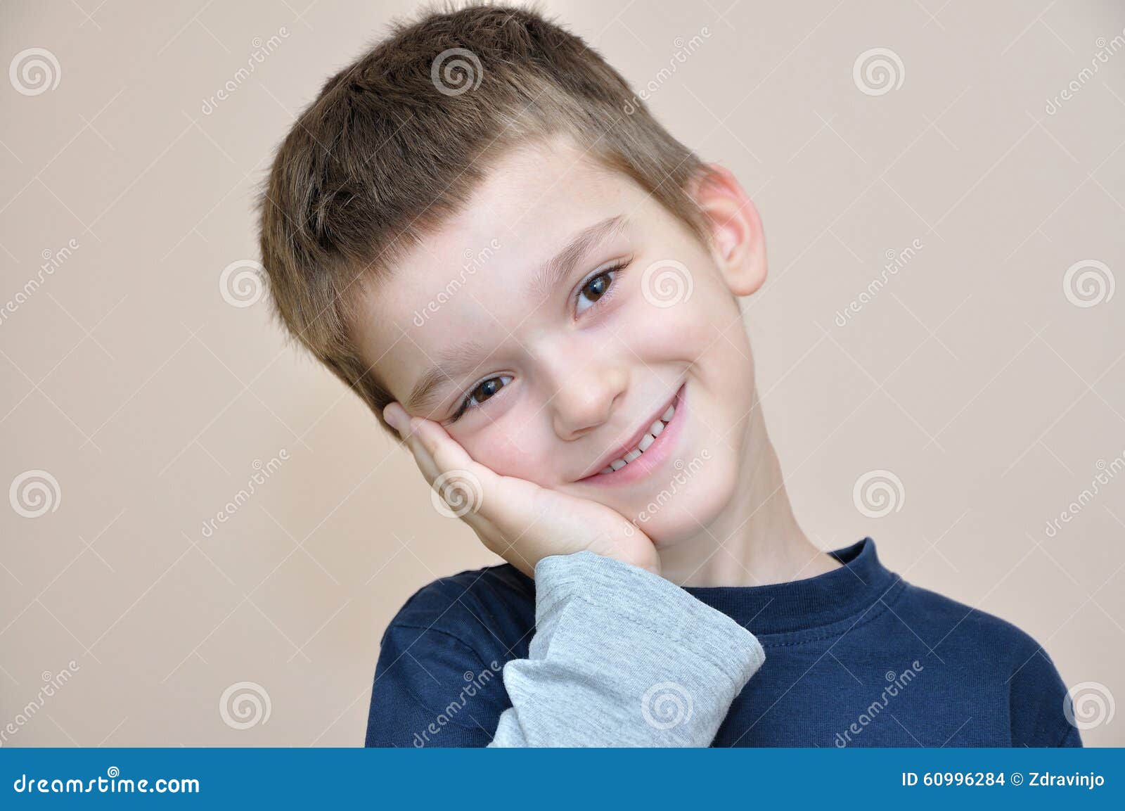 Young Boy Holding Hand on Cheek Stock Photo - Image of caucasian, hold ...
