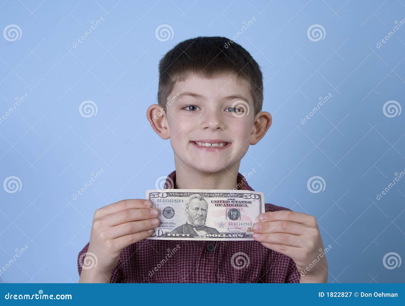 Young Boy Holding Money and Smiling Stock Image - Image of family, cute ...
