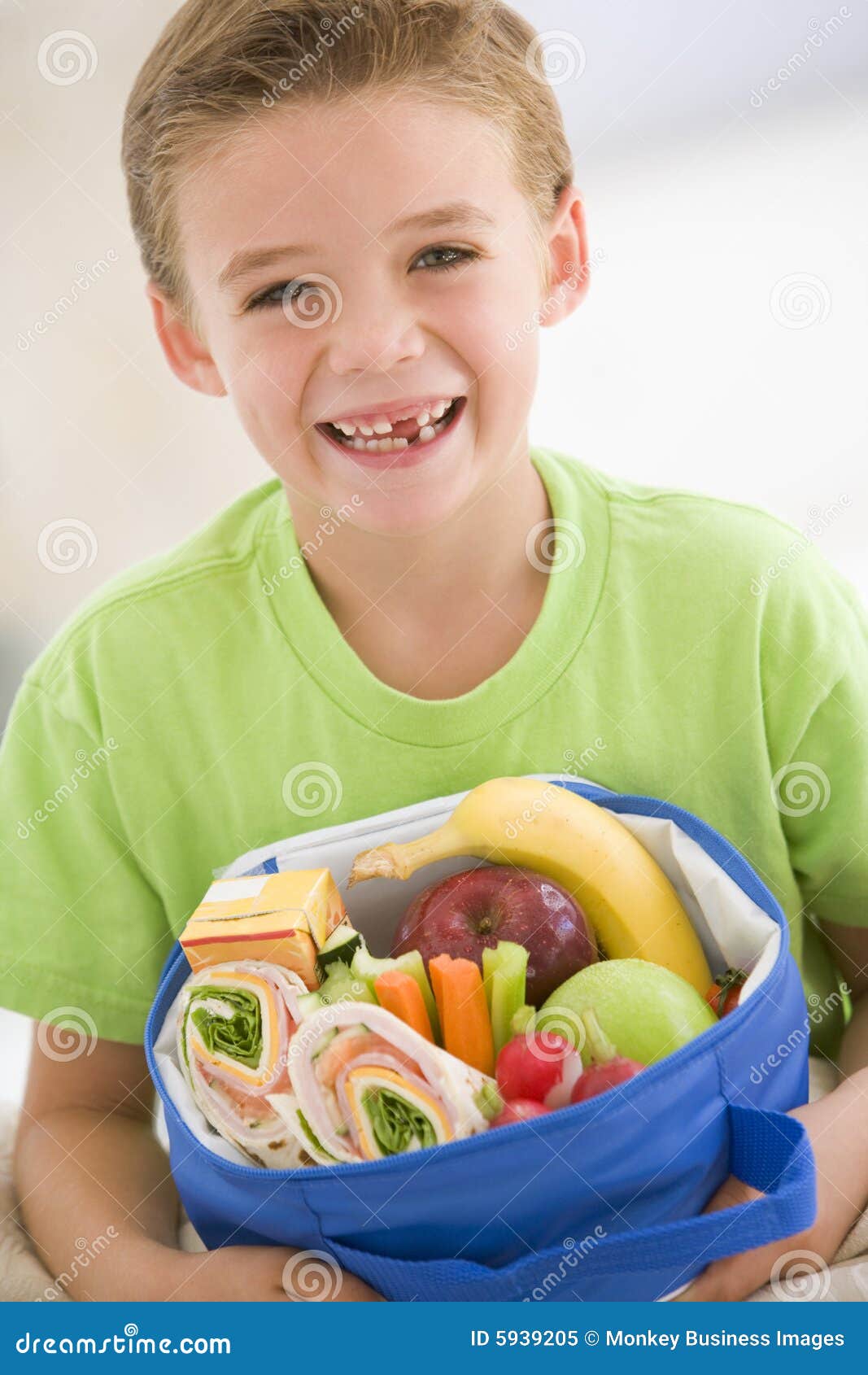 Young Boy Holding Packed Lunch in Living Room Stock Image - Image of ...