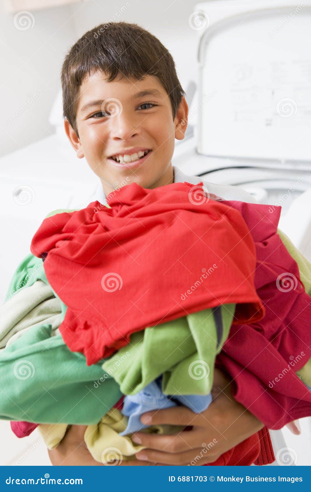 Young Boy Holding a Pile of Laundry Stock Image - Image of home ...