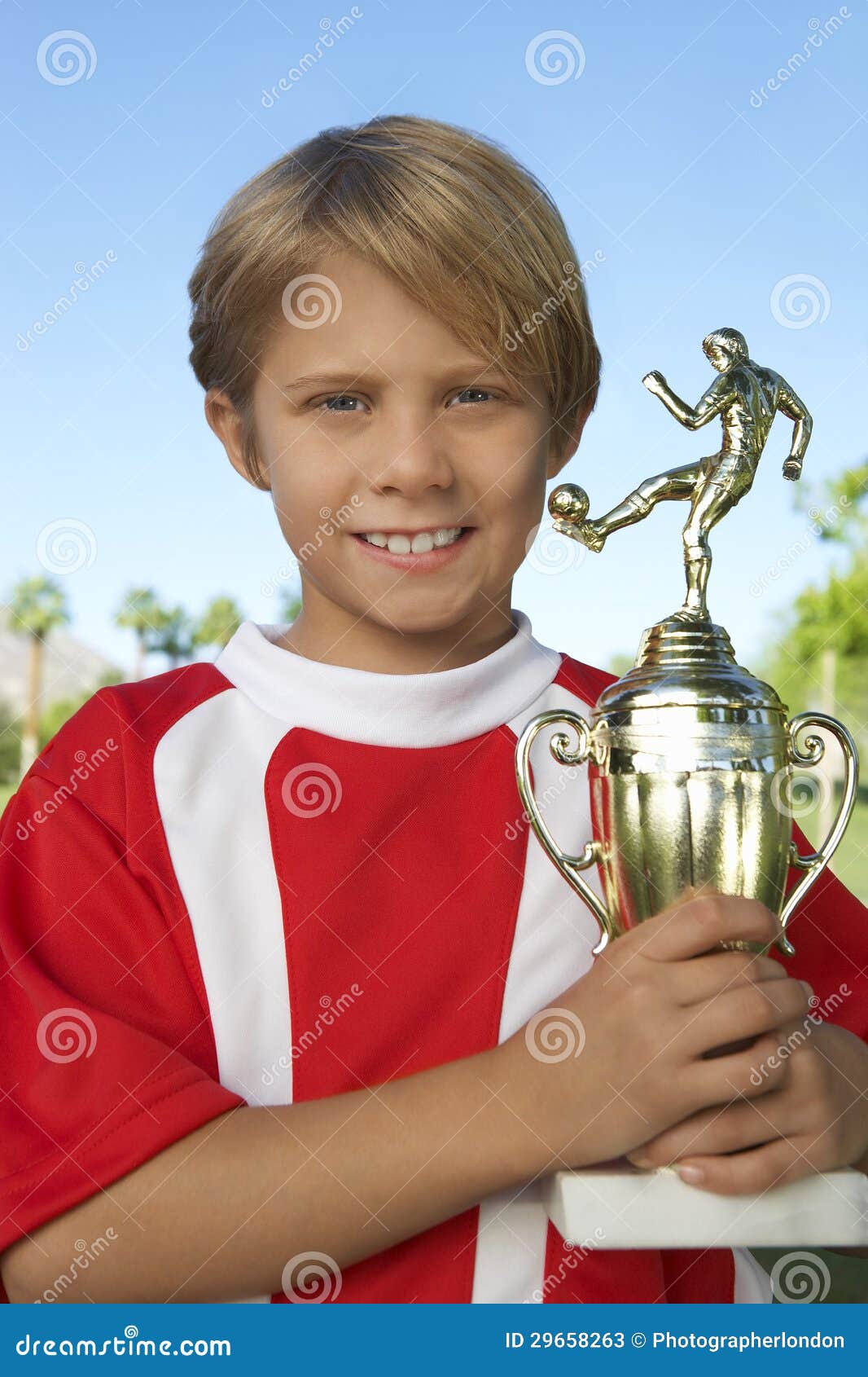 Young Boy Holding Soccer Trophy Stock Image - Image of prize, cute ...