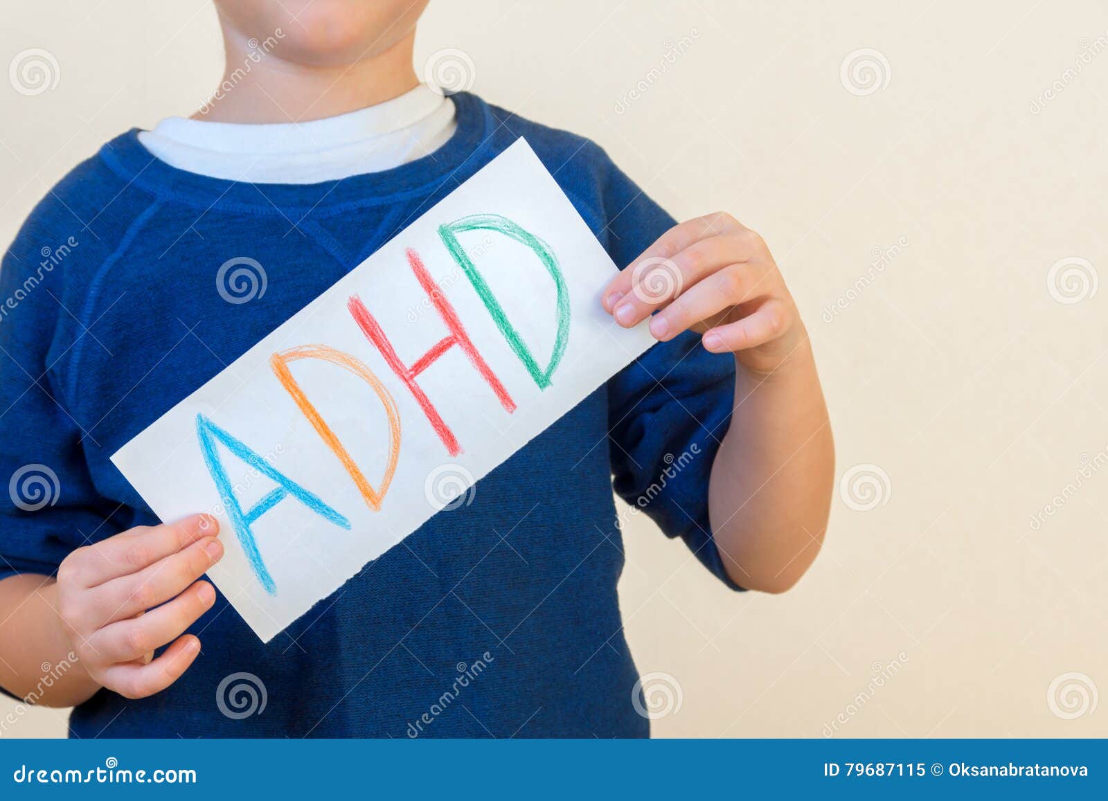 Young boy holds ADHD text stock image. Image of awareness - 79687115
