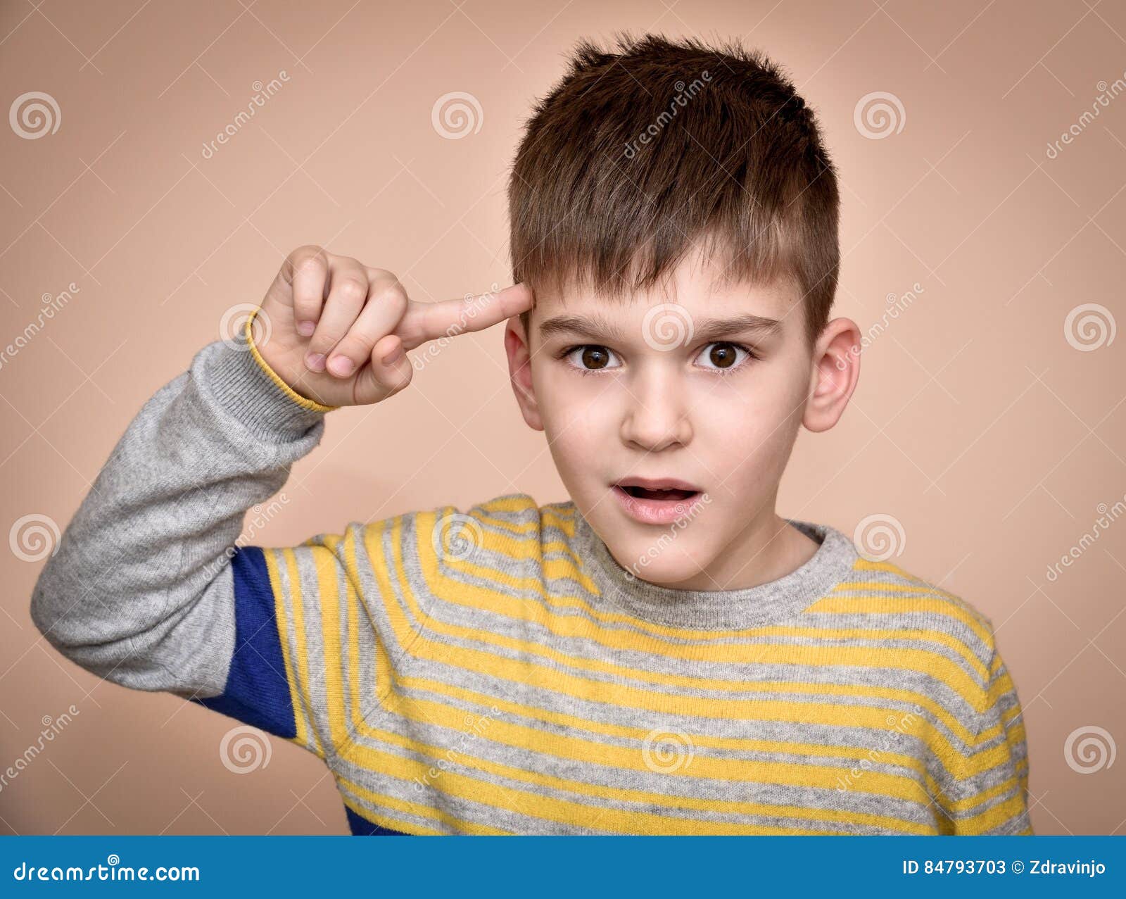 Young Boy with the Index Finger on His Head Stock Image - Image of cute ...