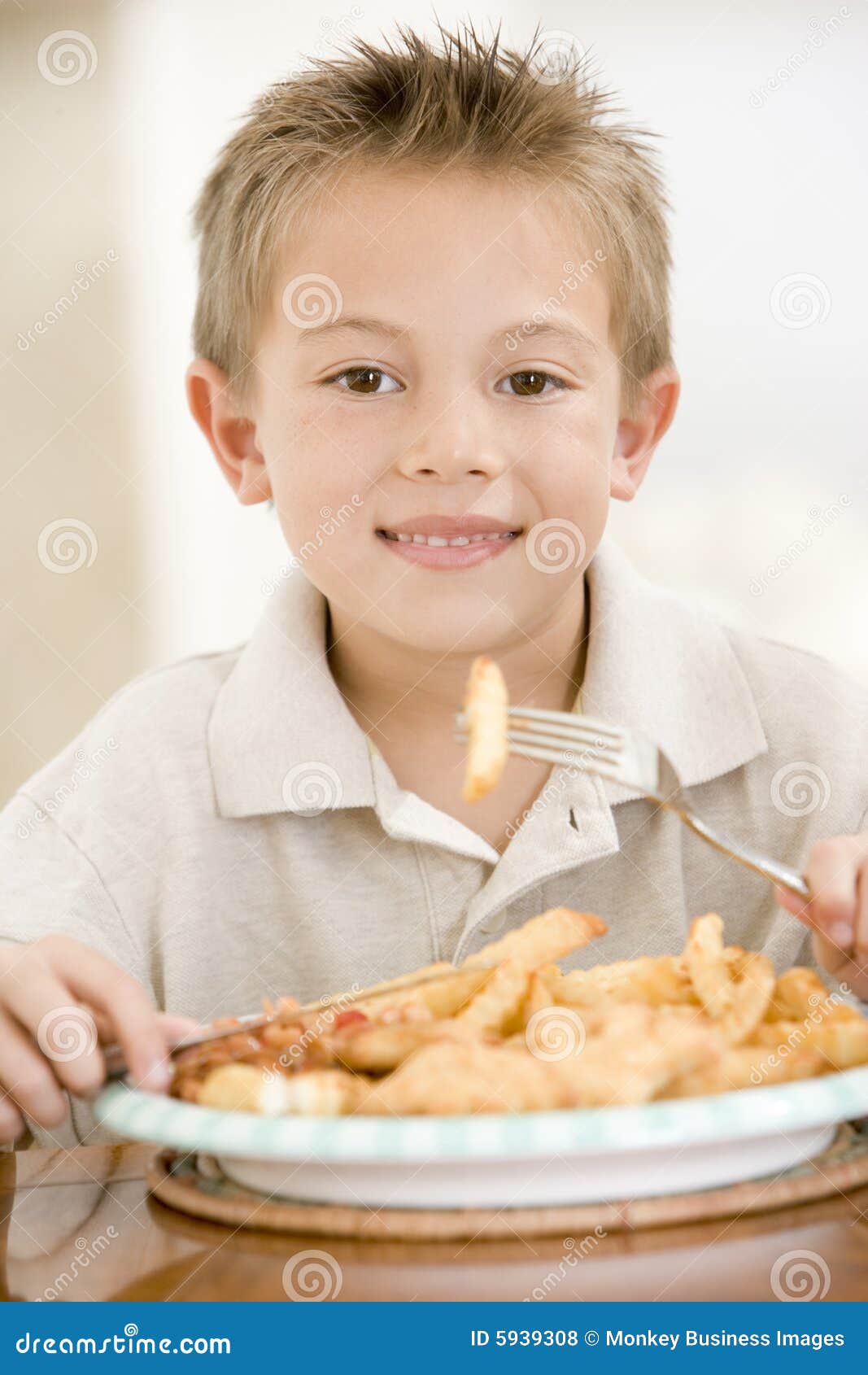 Young Boy Indoors Eating Fish and Chips Stock Photo - Image of looking ...