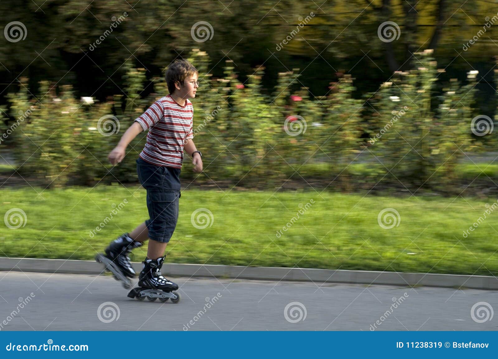 Young boy inline skating stock image. Image of teen, pleasure - 11238319