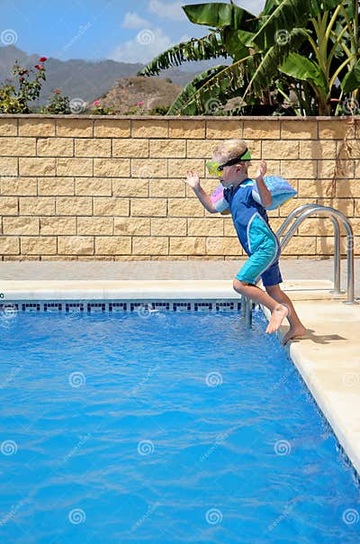 Young Boy Jumping into Pool Stock Photo - Image of vacation, trees: 2965102