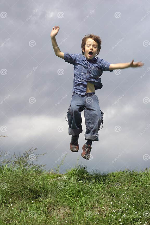 Young Boy Jumping and Shouting Stock Image - Image of weather, outdoors ...