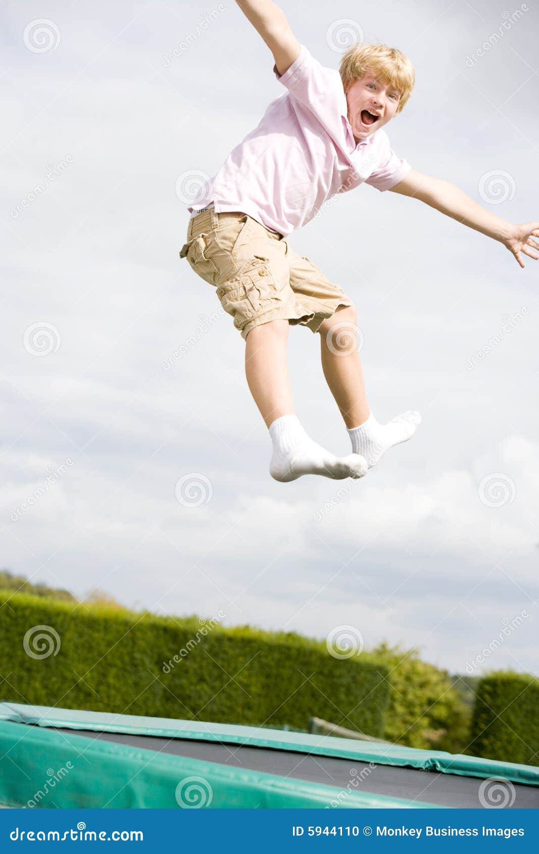 Boy Jumping On Trampoline. The Child Plays On A Trampoline Royalty-Free ...