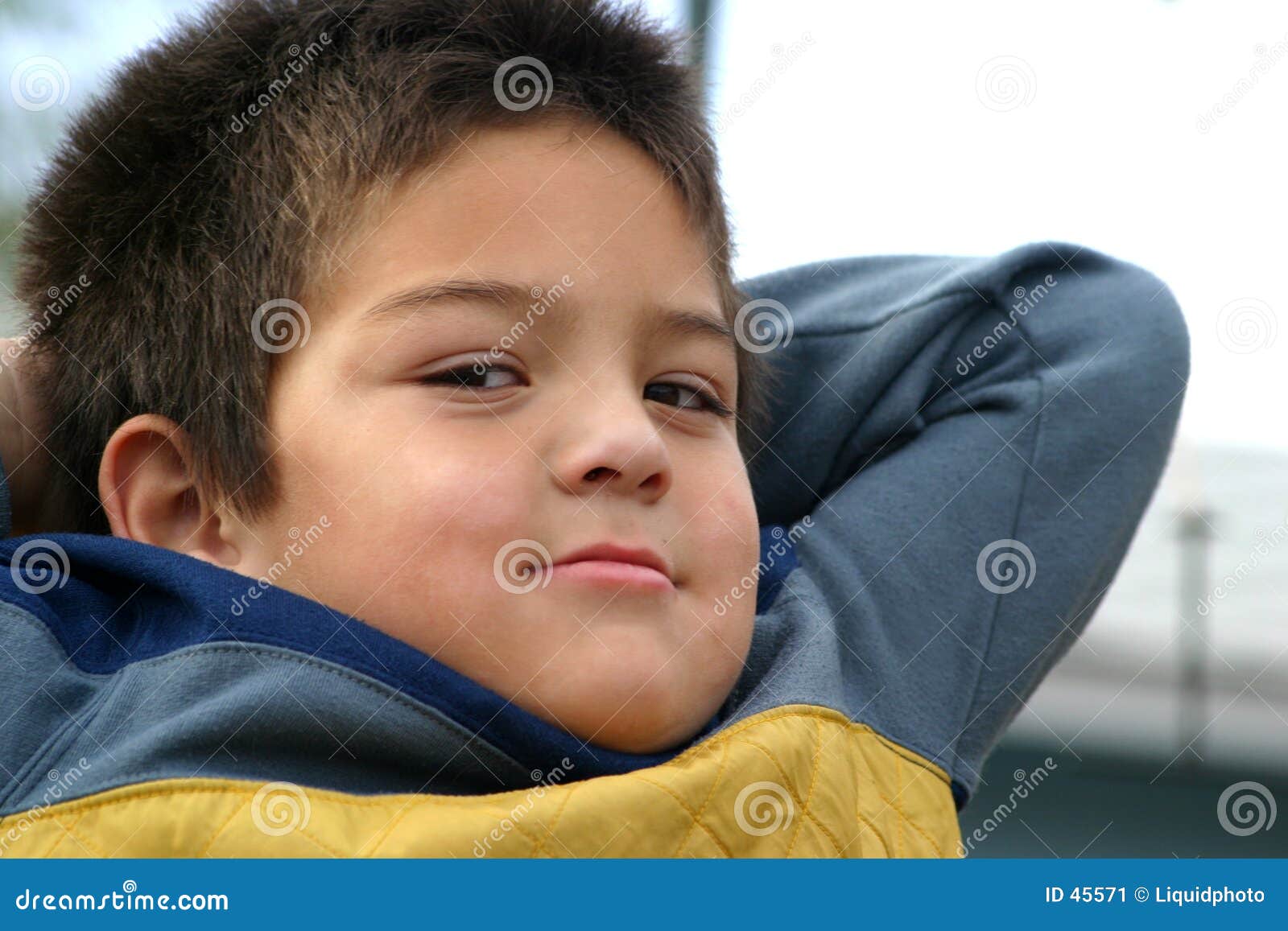 Young Boy Kicking Back stock image. Image of children, eyes - 45571