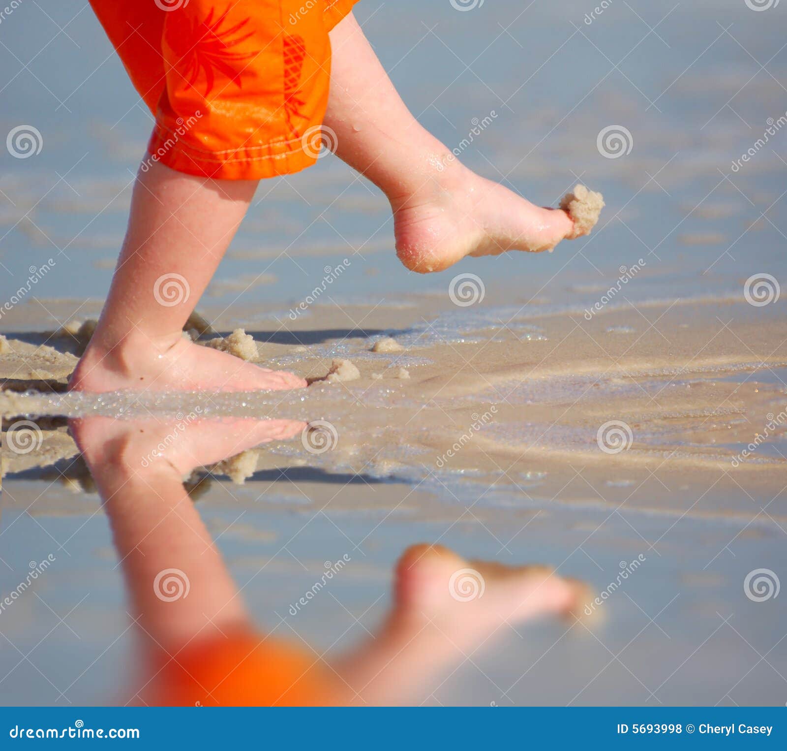 Young Boy Kicking Sand stock photo. Image of coastal, water - 5693998