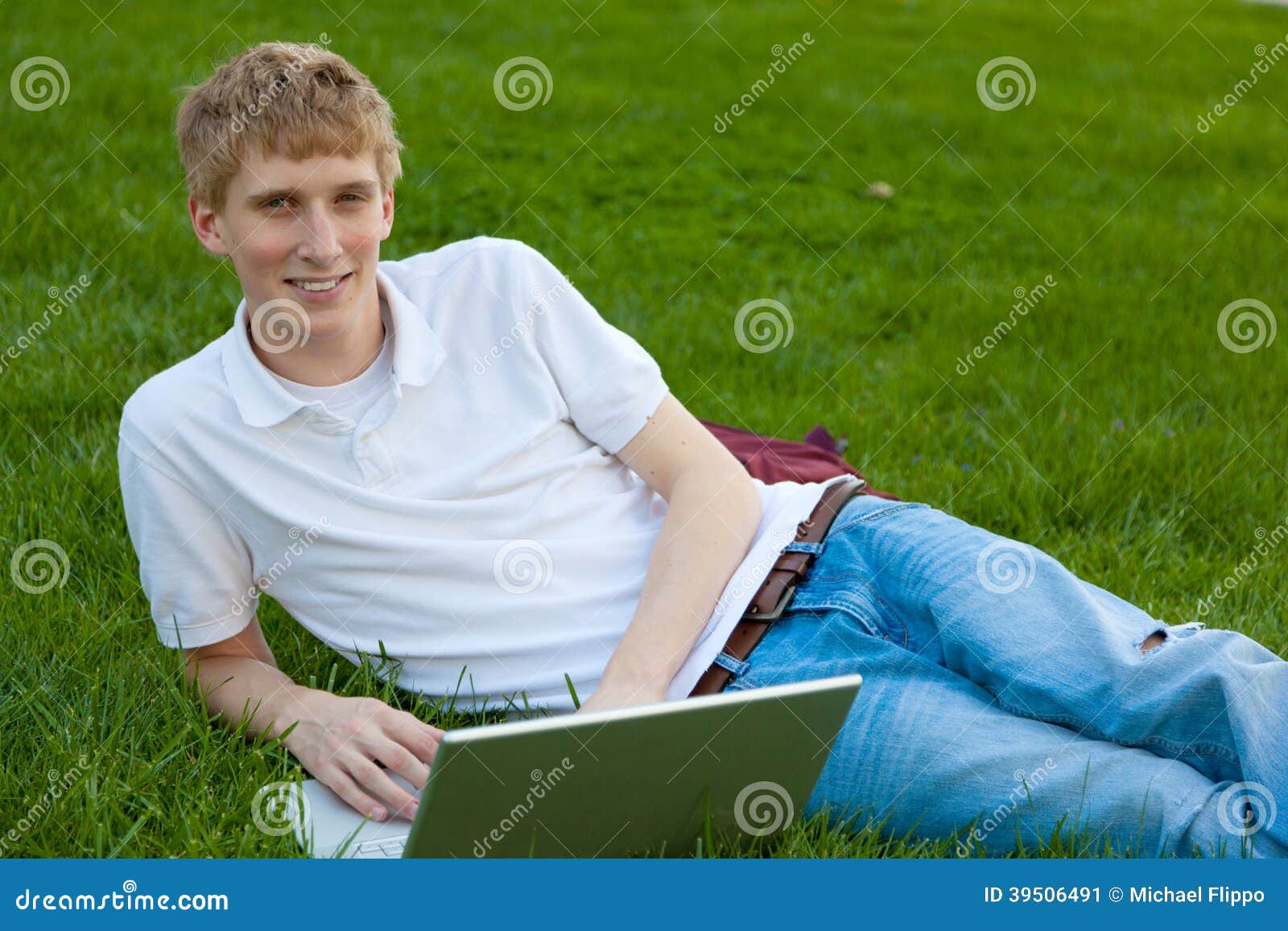 Young Boy with Laptop Computer Outside Sitting on Grass Stock Image ...