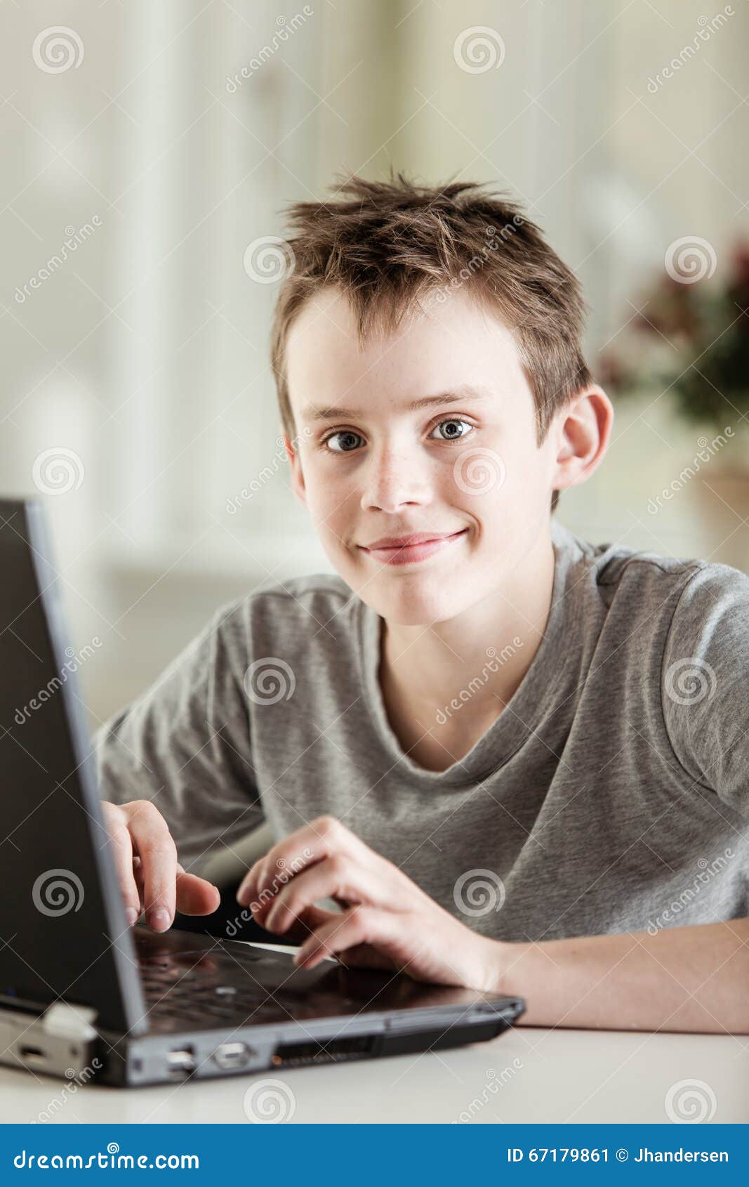 Young Boy with Laptop Smiling at the Camera Stock Image - Image of ...