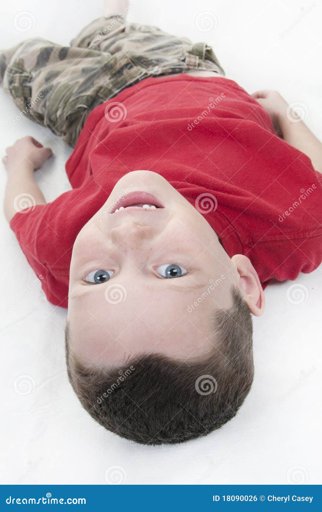 Young boy laying down stock photo. Image of eyes, reclining - 18090026