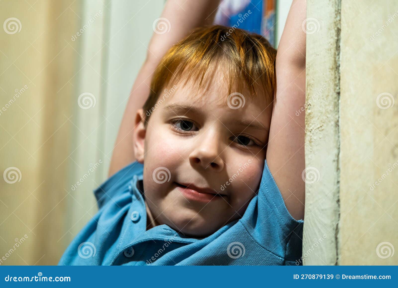 A Young Boy Leaned Against a Wall at Home Stock Image - Image of ...