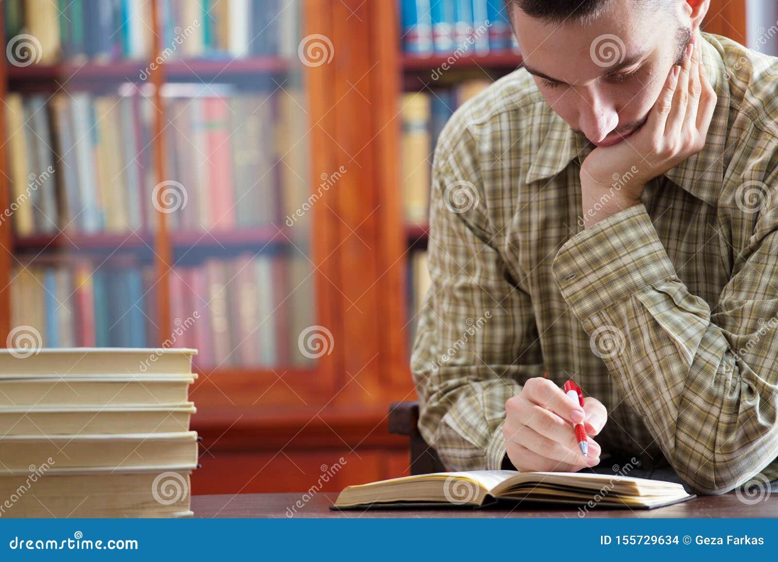 Young Boy is Learning in the Library Stock Photo - Image of person ...