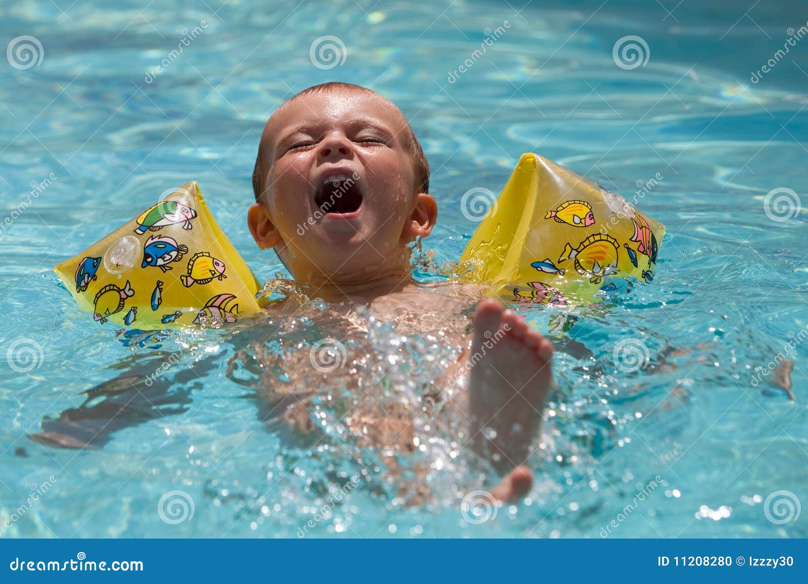 Young boy learning to swim stock photo. Image of learning - 11208280