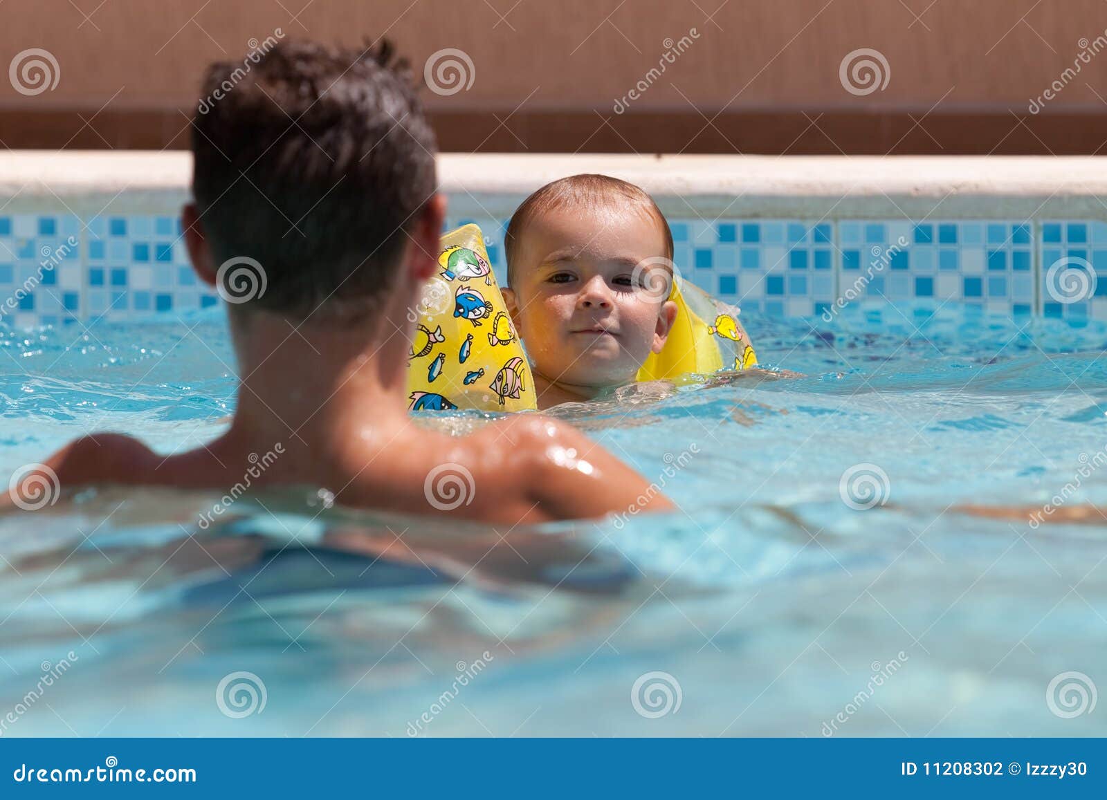 Young boy learning to swim stock photo. Image of swimming - 11208302