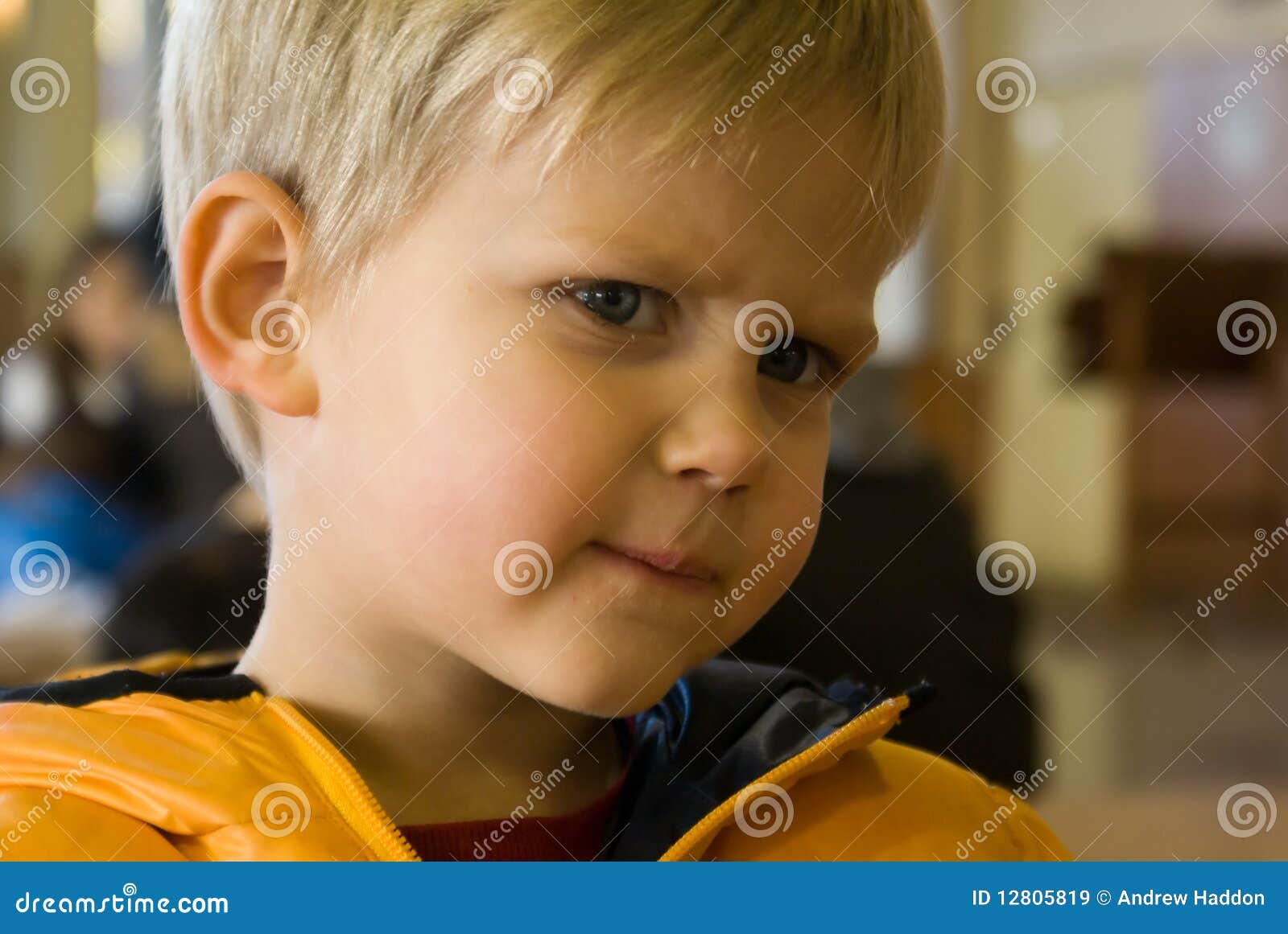 Young boy looking annoyed stock image. Image of white - 12805819