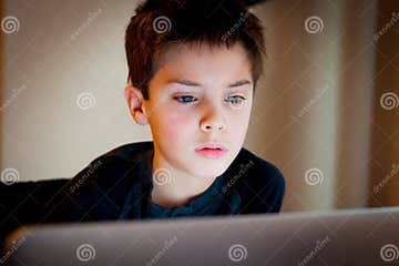 Young Boy Looking at Computer Screen Stock Photo - Image of learning ...