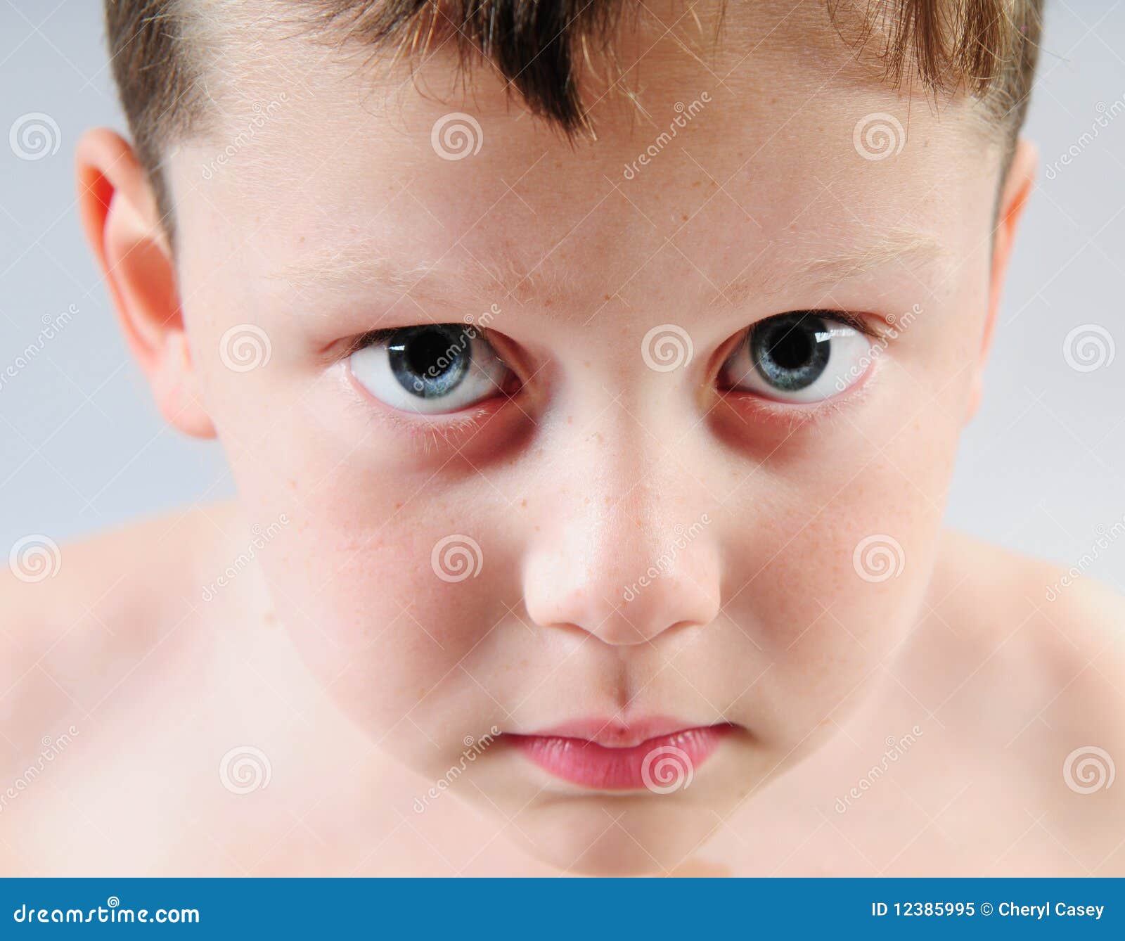 Young Boy Looking Concerned Stock Image - Image of hiding, bashful ...