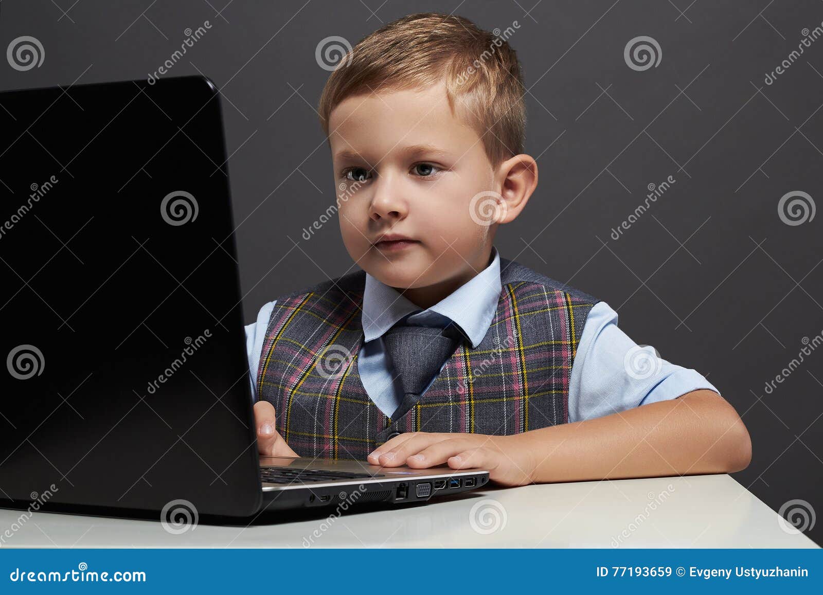 Young Boy Looking in the Notebook Screen. Funny Child with Computer ...