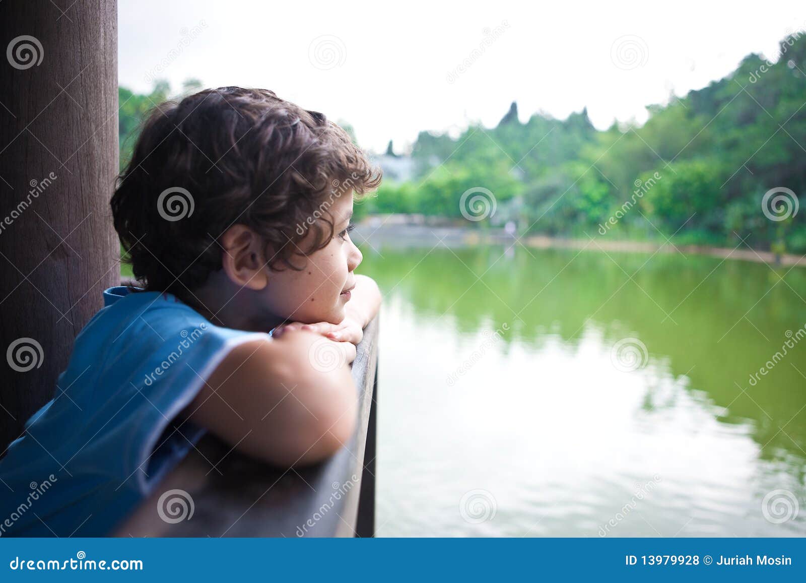 Young Boy Looking Out Across Lake Stock Photo - Image of activity, tour ...