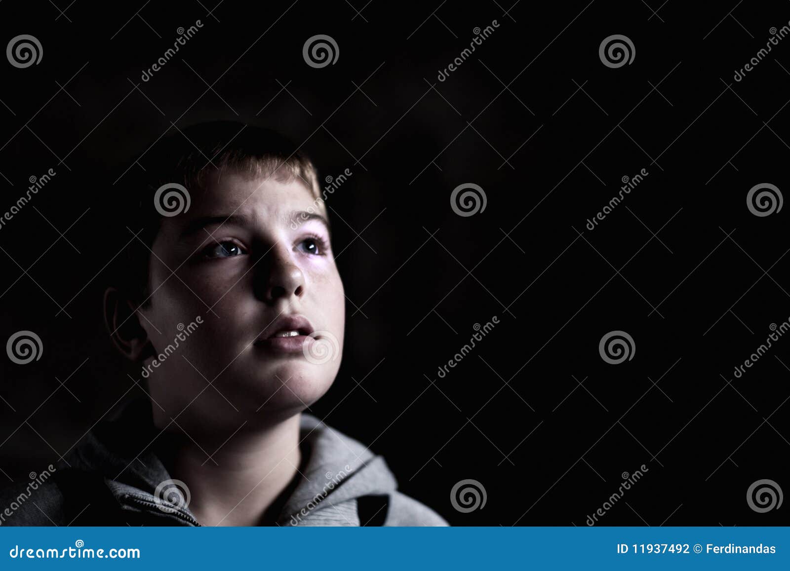Young Boy Looking Up with Hope in His Eyes Low Key Stock Photo - Image ...