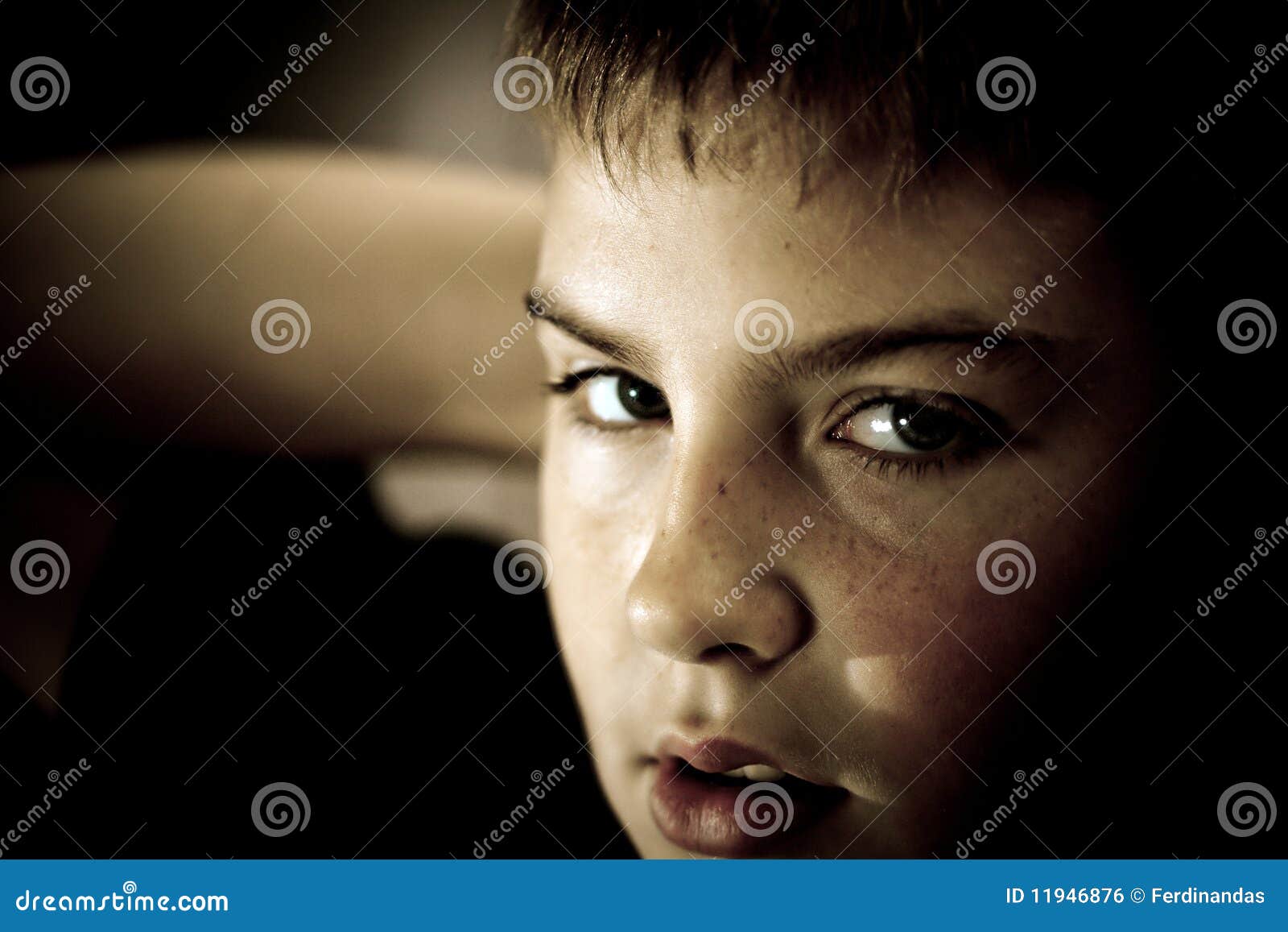 Young Boy Looking Up with Hope in His Eyes Low Key Stock Photo - Image ...