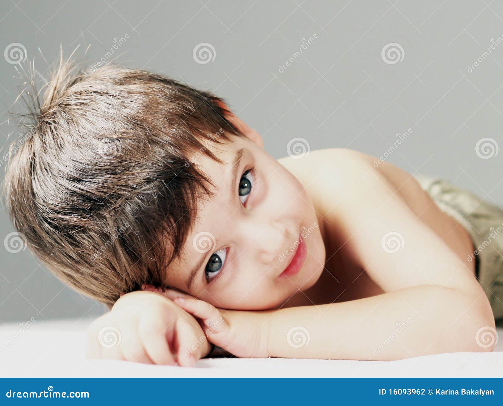 A Young Boy Lying in a Bed Smiling Stock Photo - Image of beauty, clean ... A Young Boy Lying in a Bed Smiling Stock Photo - Image of beauty, clean ...