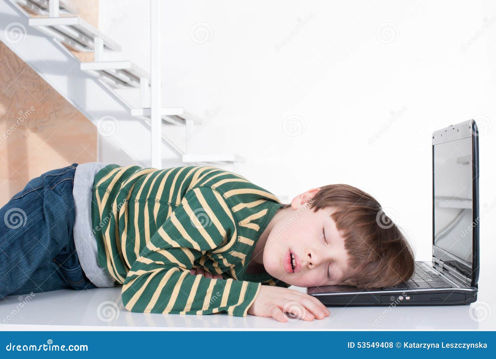 Young Boy Lying on Laptop Computer Stock Photo - Image of modern, game ...