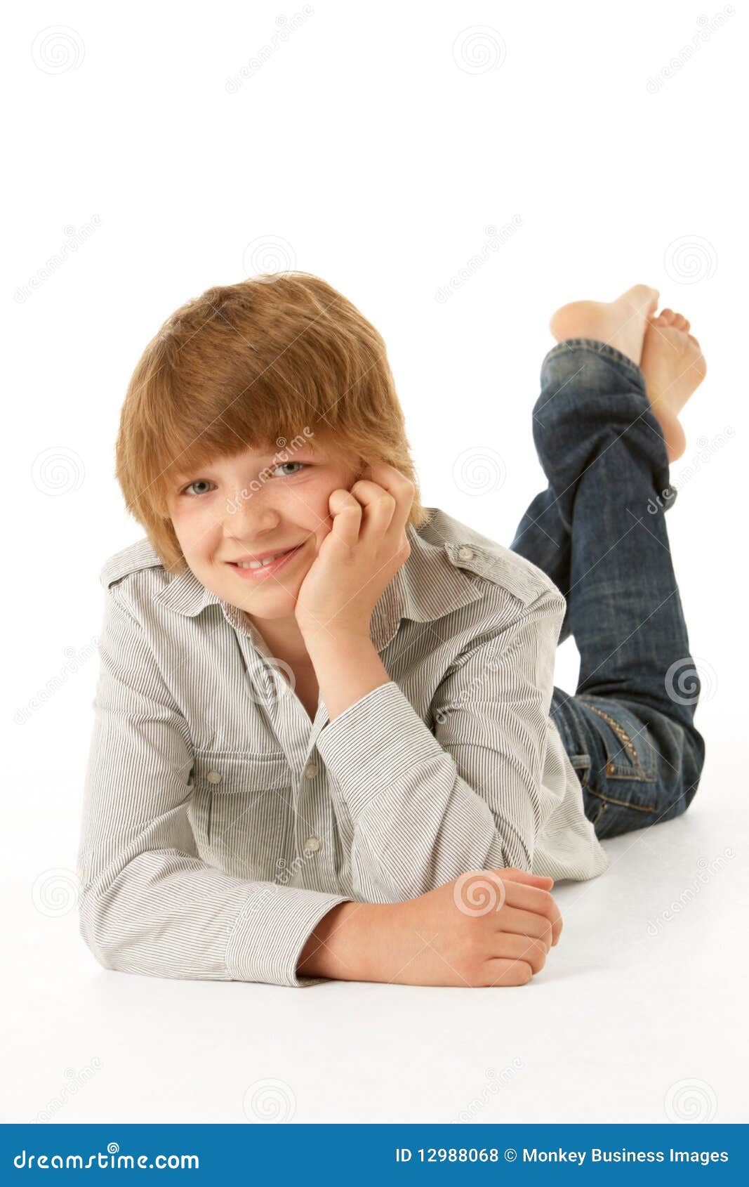 Young Boy Lying on Stomach stock photo. Image of year - 12988068