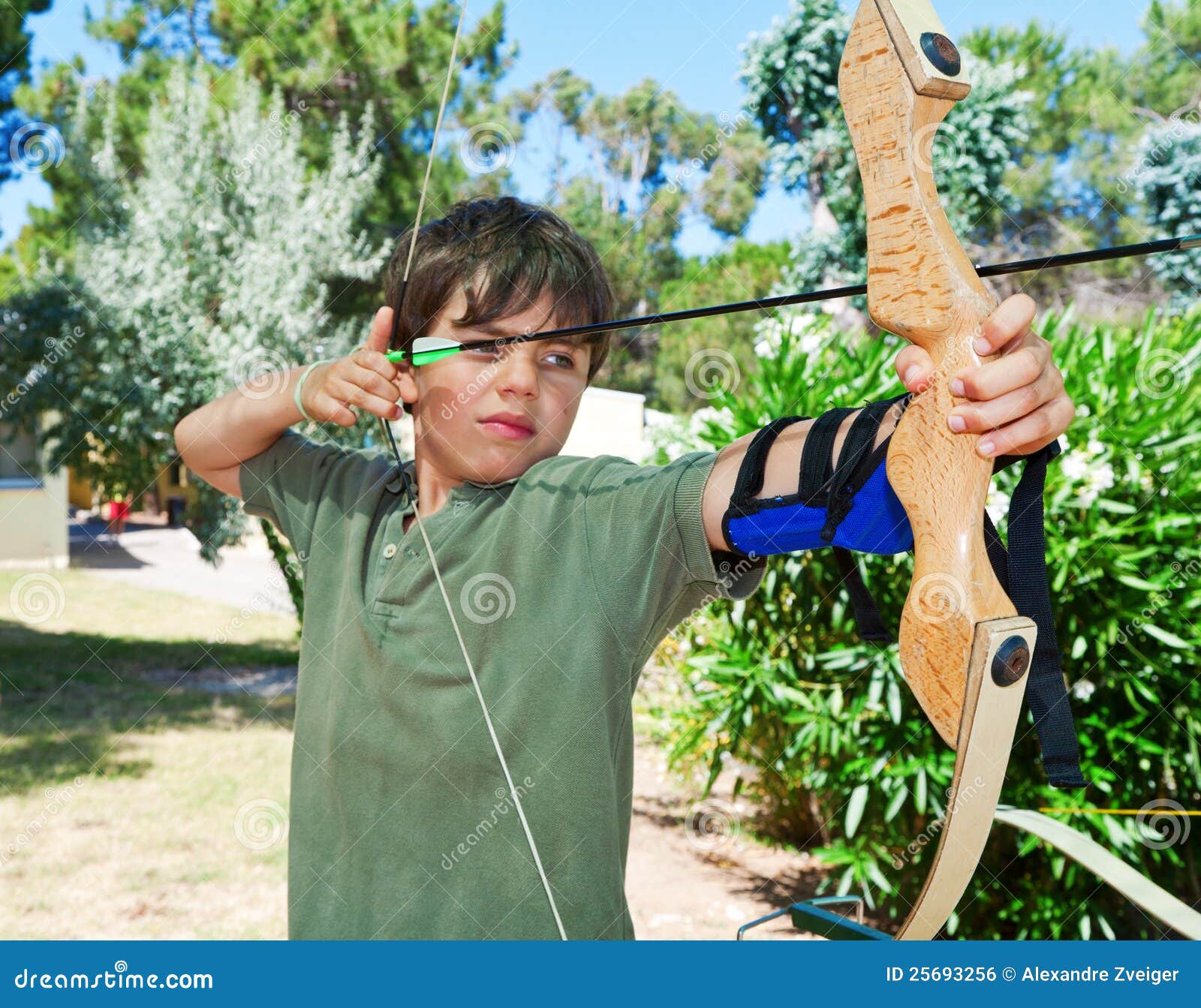 Young boy makes archery stock photo. Image of outside - 25693256