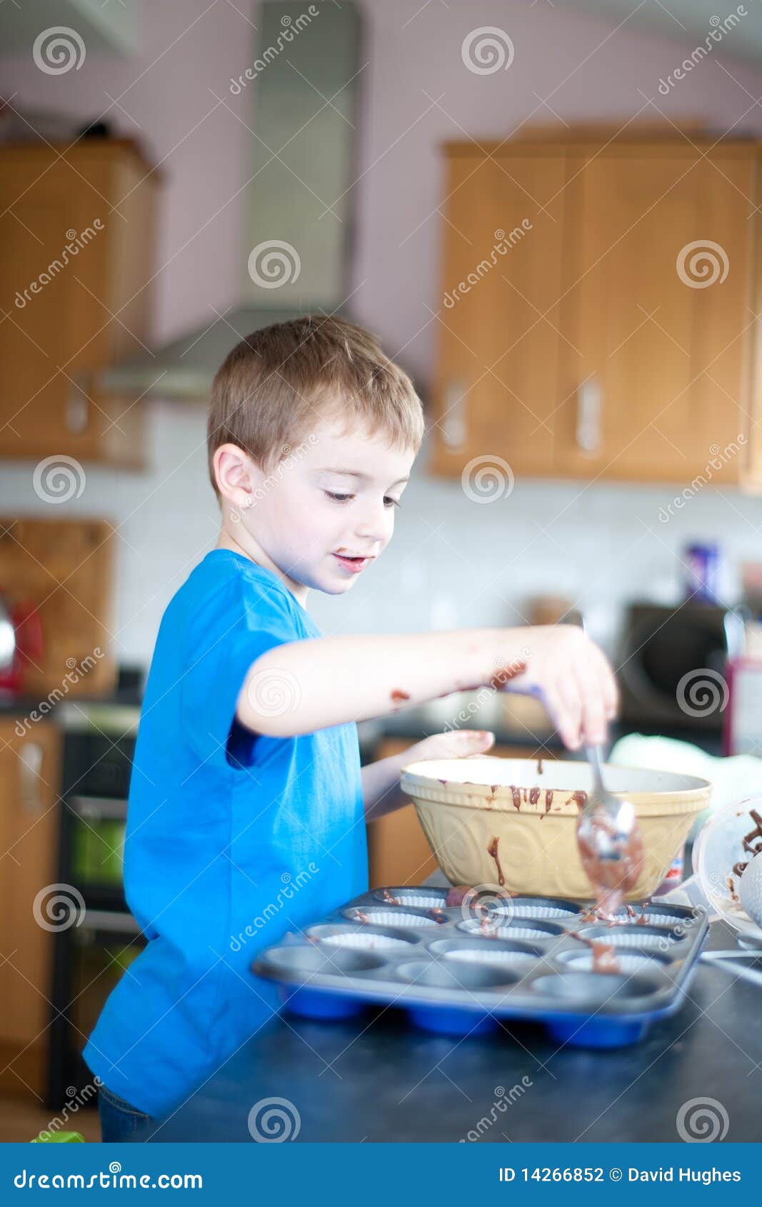 Young Boy Making Chocolate Cakes Stock Photo - Image of cooking, bake ...