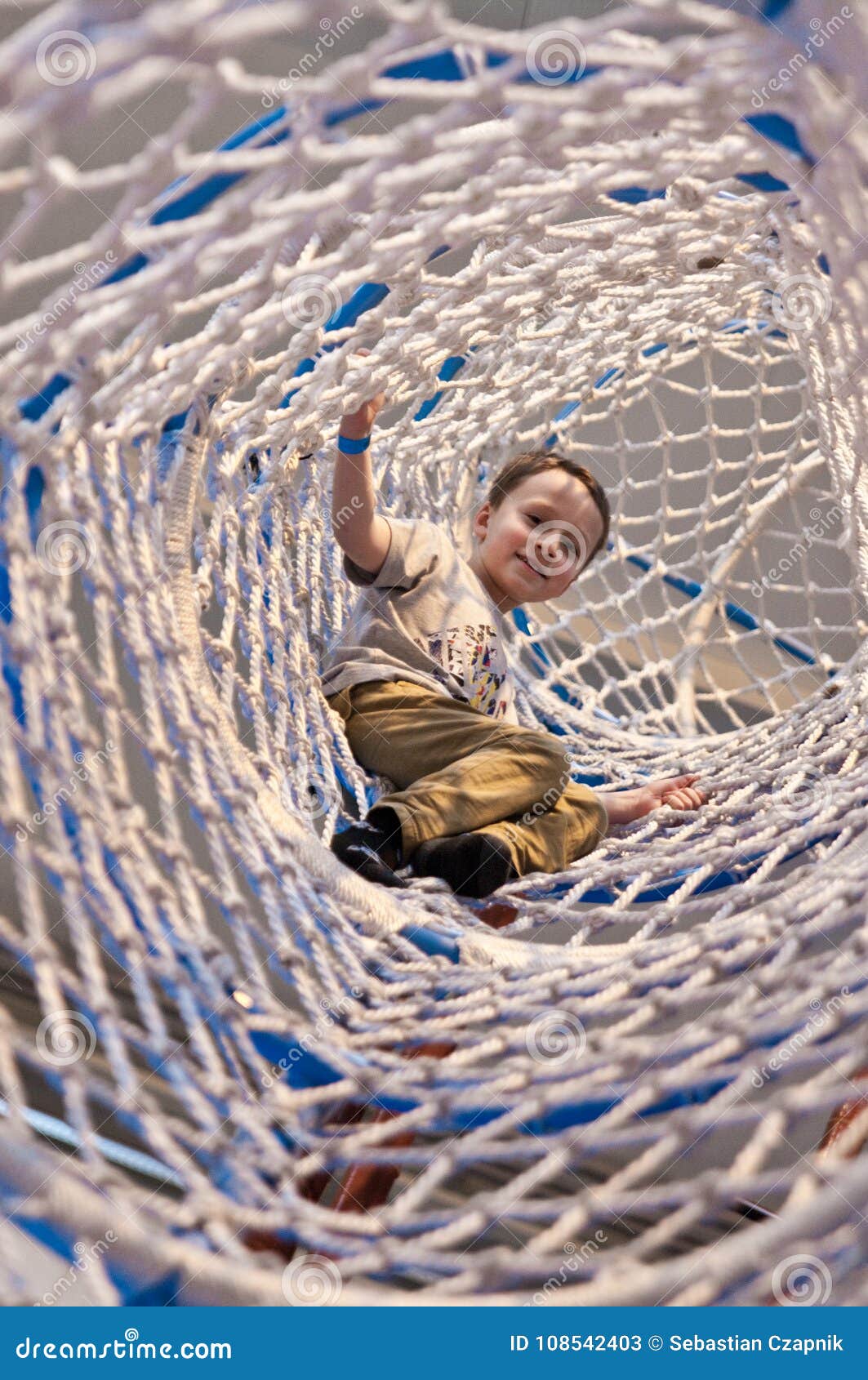 Boy in Net Sleeve of Amusement Park Climbing Facility Stock Image ... Boy in Net Sleeve of Amusement Park Climbing Facility Stock Image ...