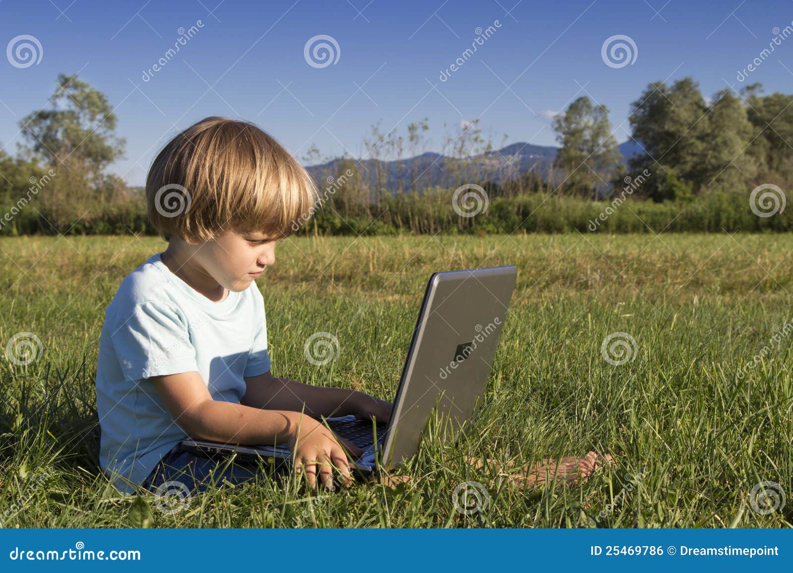 Young boy with notebook stock photo. Image of meadow - 25469786