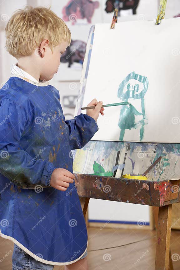 Young Boy Painting stock photo. Image of school, four - 10971692