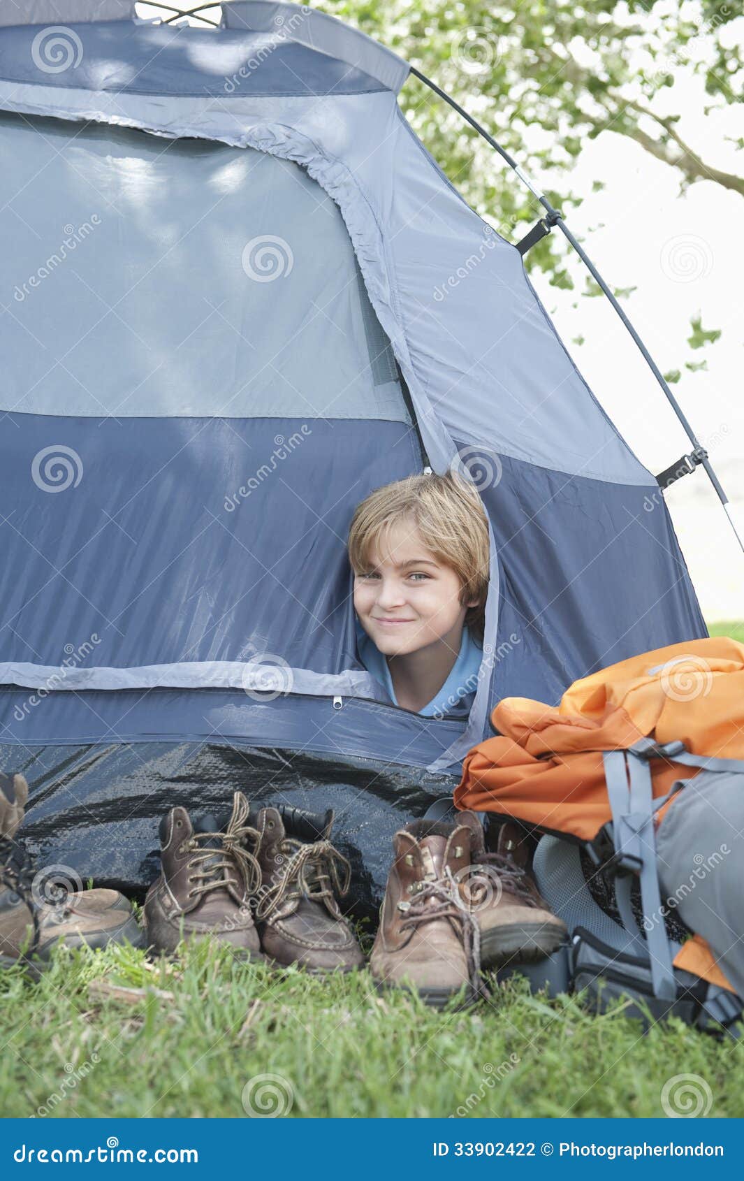 Young Boy Peaks Out of Tent Stock Photo - Image of rural, equipment ...
