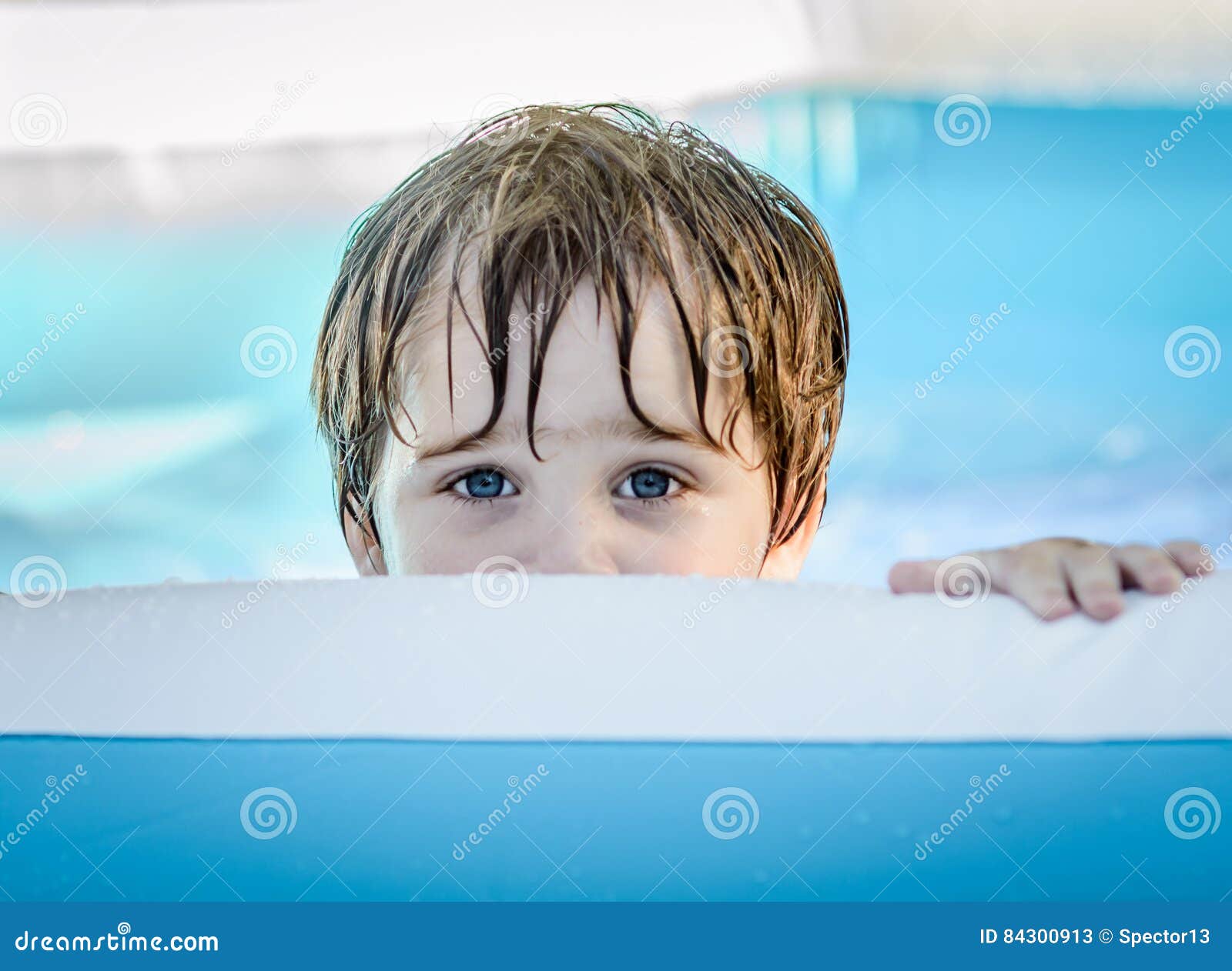 A young boy peeking out stock image. Image of small, bright - 84300913