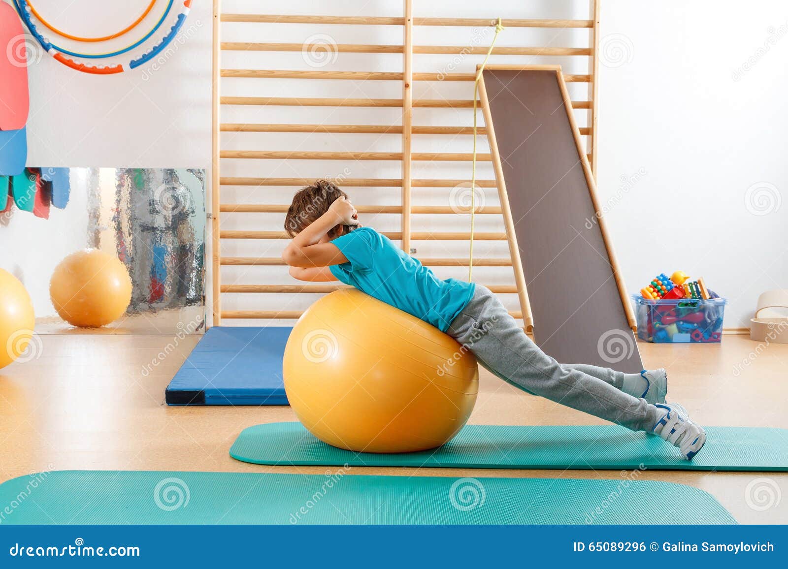 Young Boy Performs Exercises Stock Photo - Image of child, gymnastic ...
