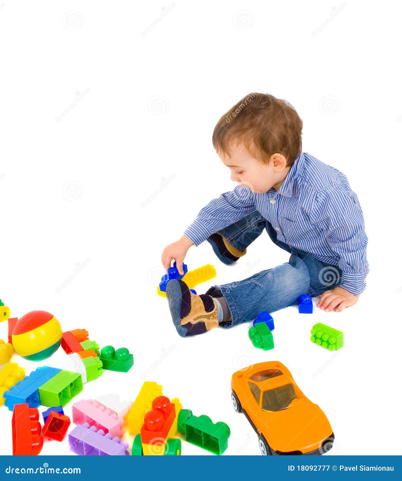 Young boy play with bricks stock image. Image of education - 18092777