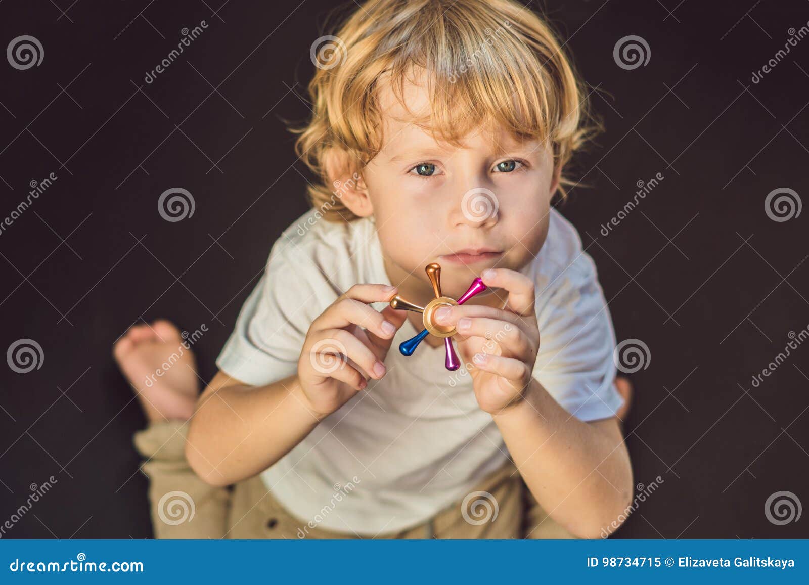 Young Boy Play with Fidget Spinner Stress Relieving Toy Stock Image ...