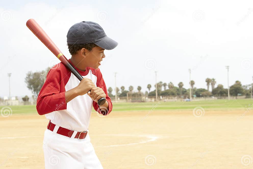 Young Boy Playing Baseball stock image. Image of wearing - 12406111