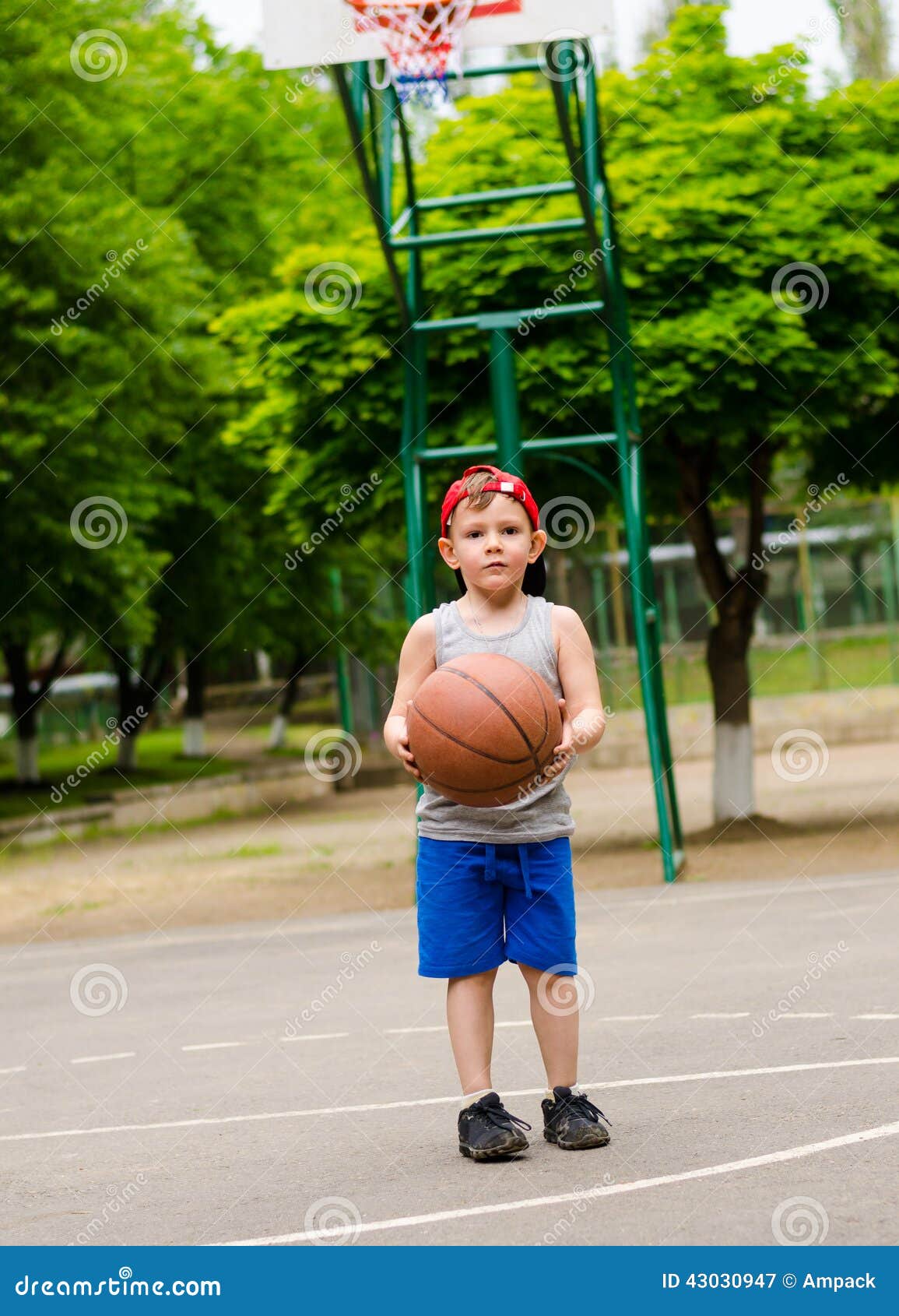 Young Boy Playing Basketball Stock Image - Image of basketball, playful ...