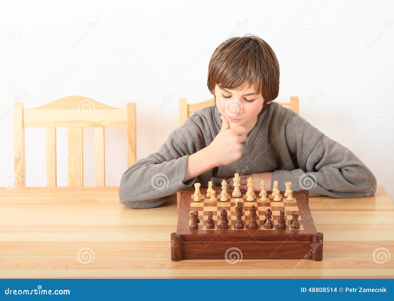 Young boy playing chess stock photo. Image of concentrate - 48808514