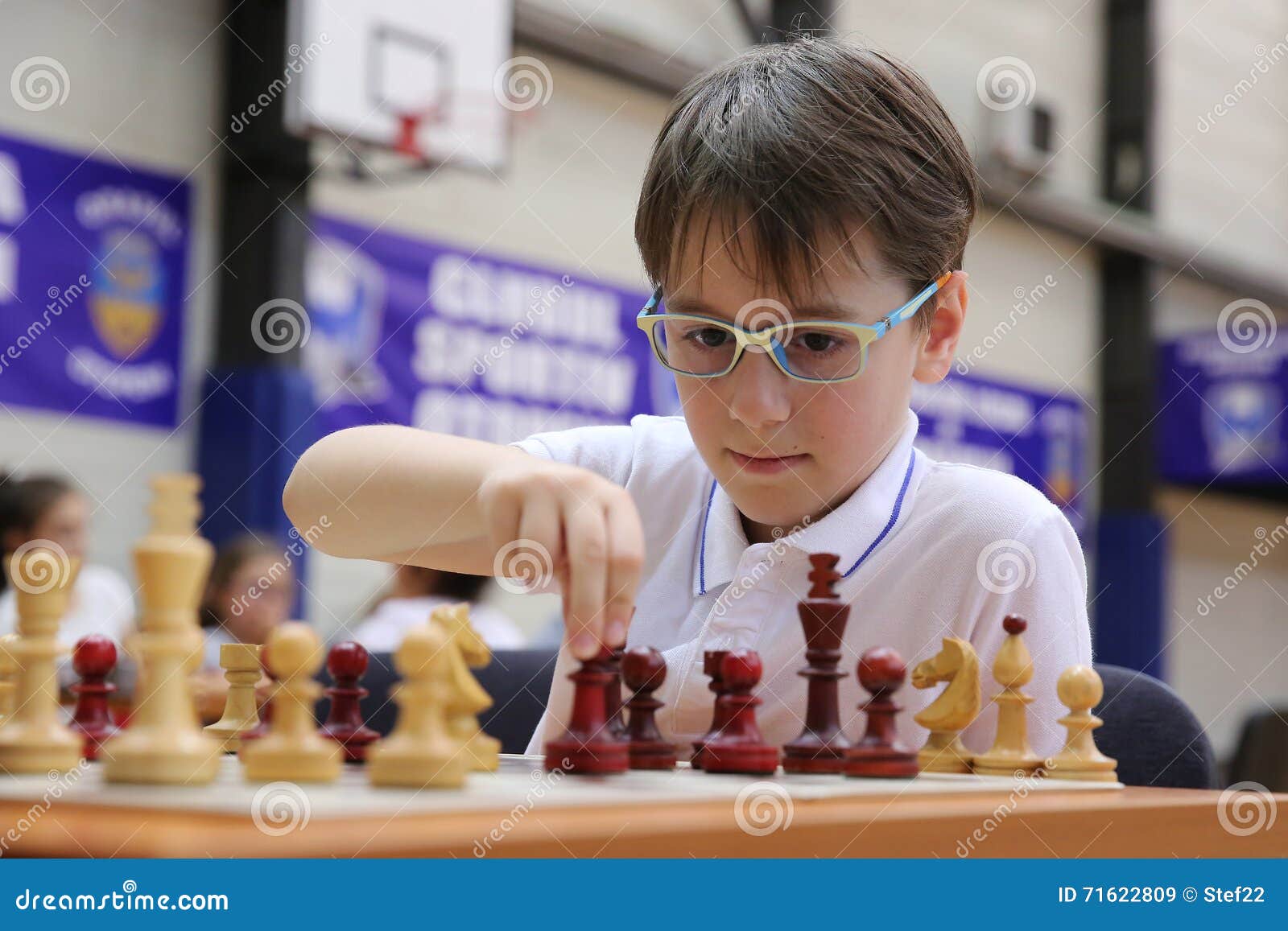 Young boy playing chess editorial stock image. Image of activity - 71622809