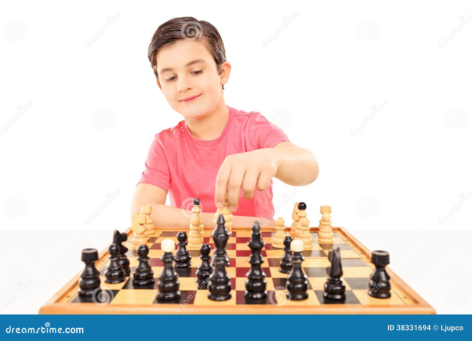 Young Boy Playing Chess Seated at a Table Stock Photo - Image of ...