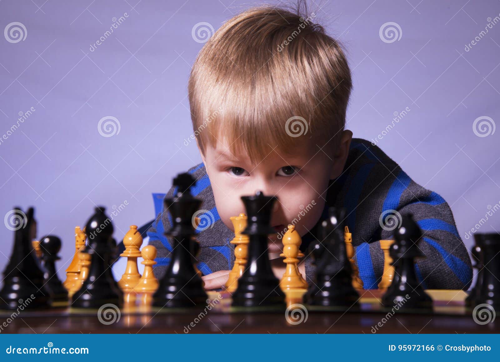 Young boy playing chess stock photo. Image of male, challenge - 95972166