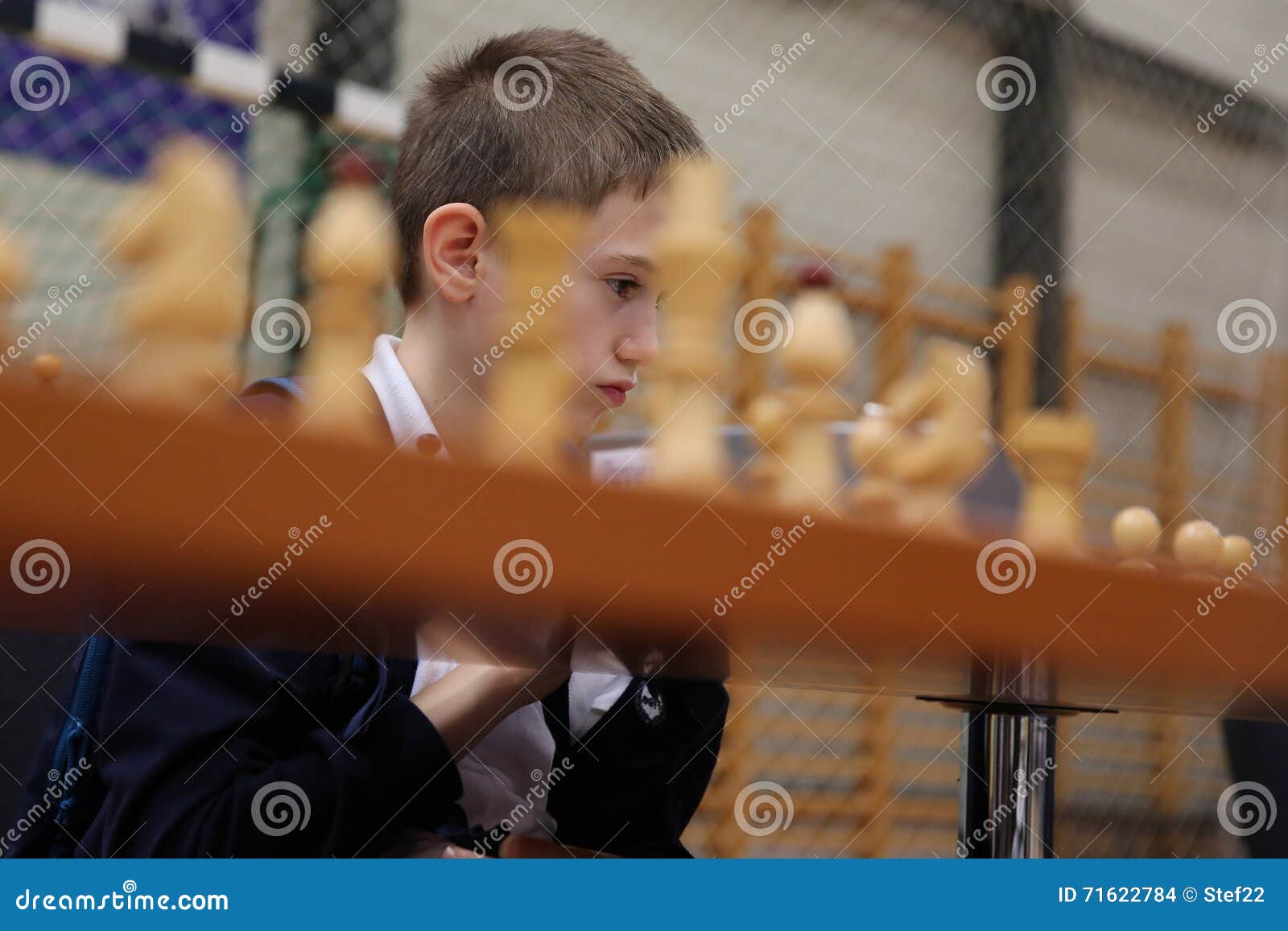 Young boy playing chess editorial stock image. Image of male - 71622784