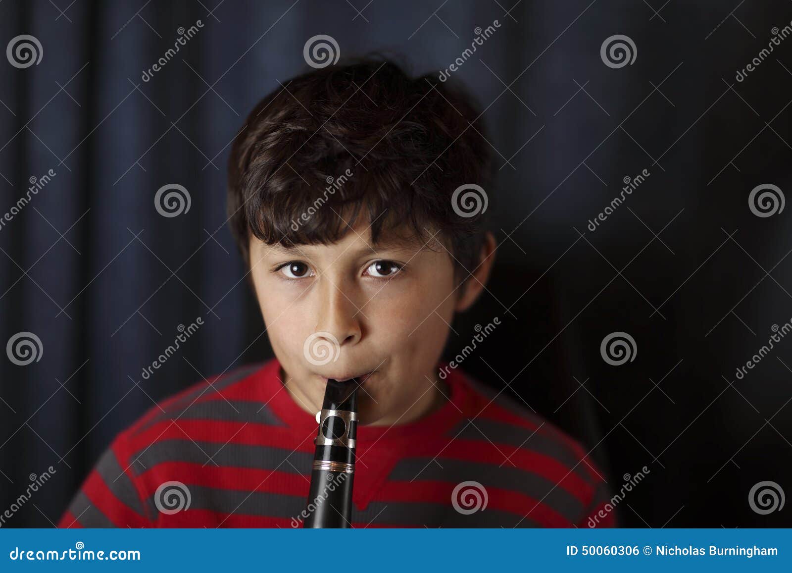 Young Boy Playing the Clarinet Stock Photo - Image of instrument, arts ...